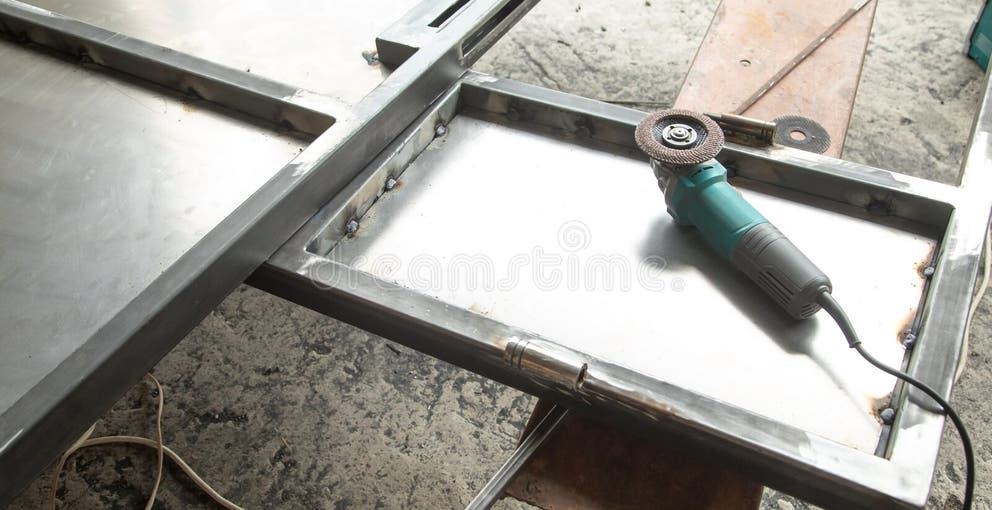 Angle Grinder Machine on Iron Gate. Metalworking Stock Photo - Image of ...