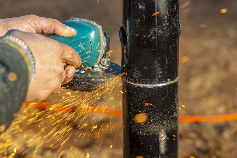 Angle Grinder, Pipe End. Foundation Works. Locksmith Stock Photo ...
