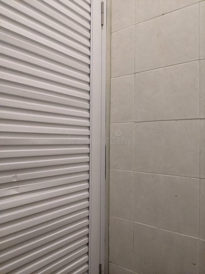 The Angle between the Patterned Door and the Tiled Wall Stock Image ...