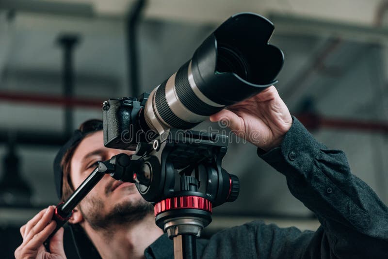 Angle View of Videographer Looking through Viewfinder of Camera Stock ...