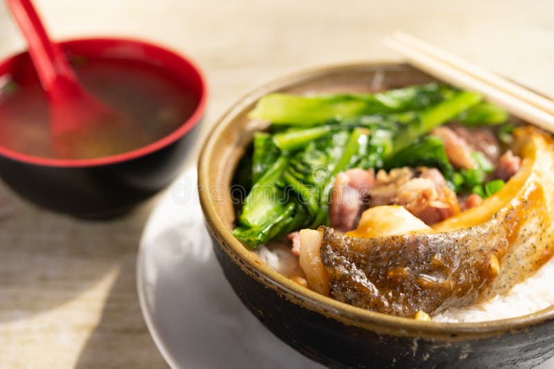 Clay Pot Rice with Fish and Pickled Duck and Vegetable Stock Image ...