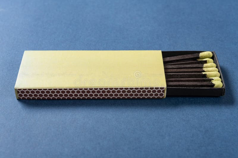 Grass Green Matchbox on a Blue Background at Horizontal Composition ...