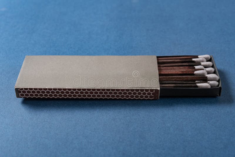 Angle View Grey Color Matchbox and Grey Match Sticks on Blue Background ...