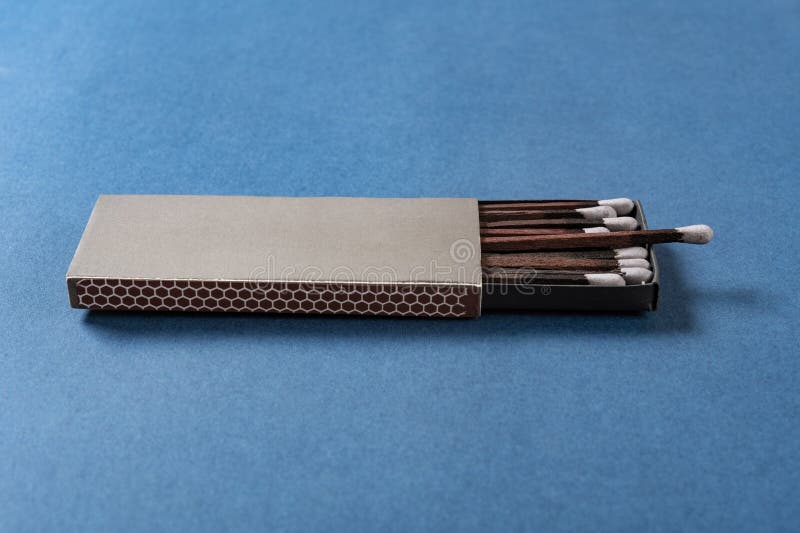 Angle View Grey Color Matchbox and Grey Match Sticks on Blue Background ...