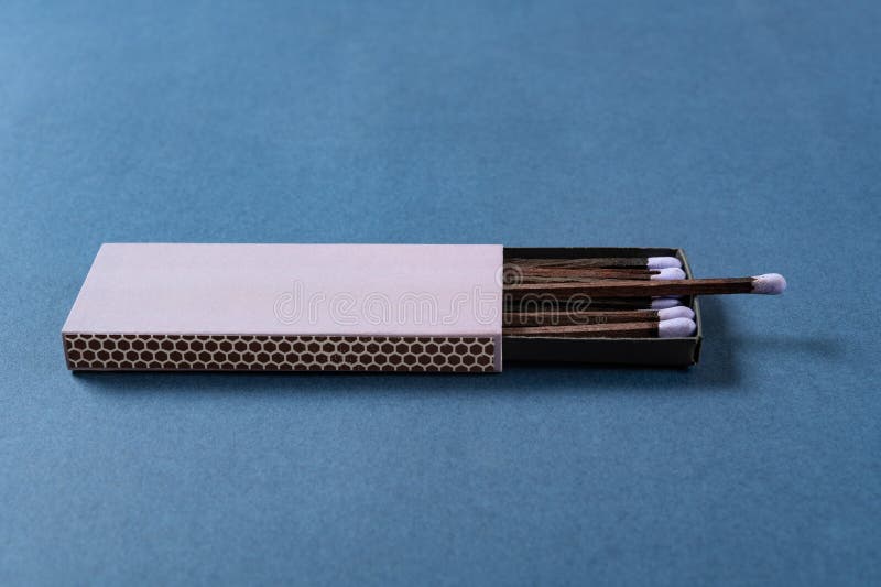 Angle View Lilac Matchbox on a Blue Background at Horizontal ...