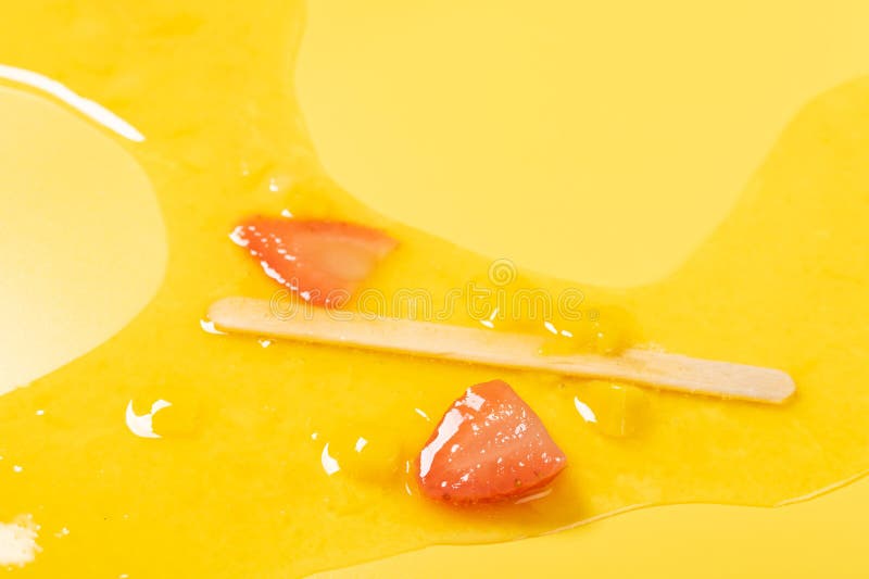 Melted Mango Fruit Flavor with Strawberry Slices Popsicle on Yellow ...