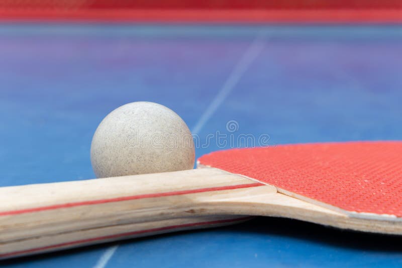 Angle View Pingpong Racket and Ball and Net on a Blue Pingpong Table ...