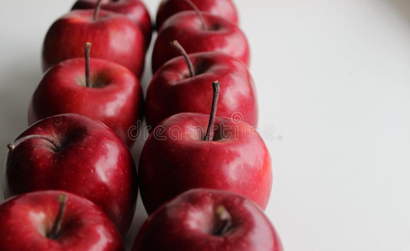 Angle View of Rows with Organic Red Apple Fruits on White Surface at a ...