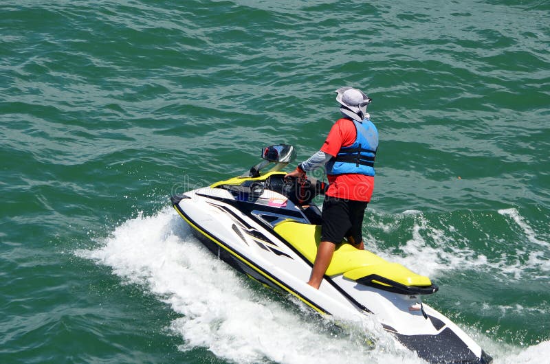 Man Standing Up on a Speeding Jet Ski Stock Photo - Image of recreation ...