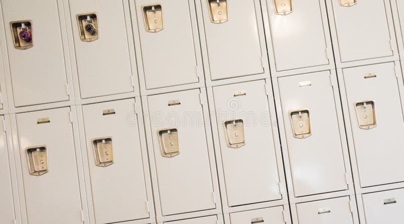 An Angled Photo of a Row of Tan Lockers in an Education Setting. Stock ...