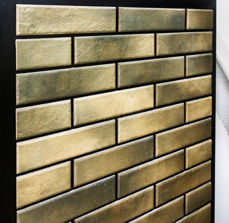 Angled View of Glossy, Textured Brown and Green Subway Tiles in a Brick ...