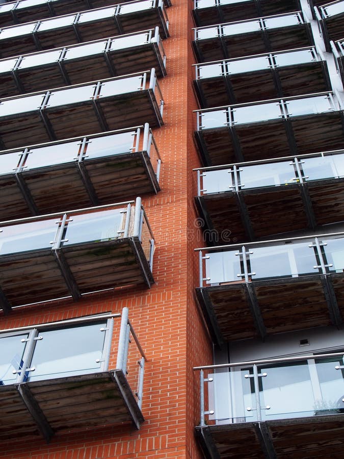 Angled View of Modern Apartment Building with Windows in Brick Walls ...