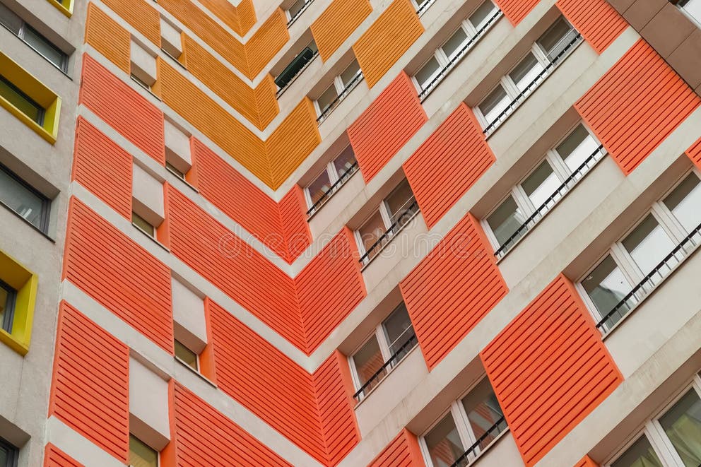 Angled View of a Modern Building Facade with Orange Cladding and ...