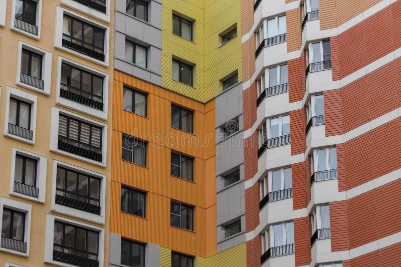 Angled View of a Modern Building Facade with Orange Cladding and ...