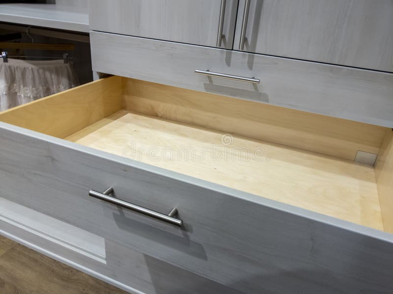View Of An Open, Empty Dresser Drawer Inside A Large, Spacious Walk In ...