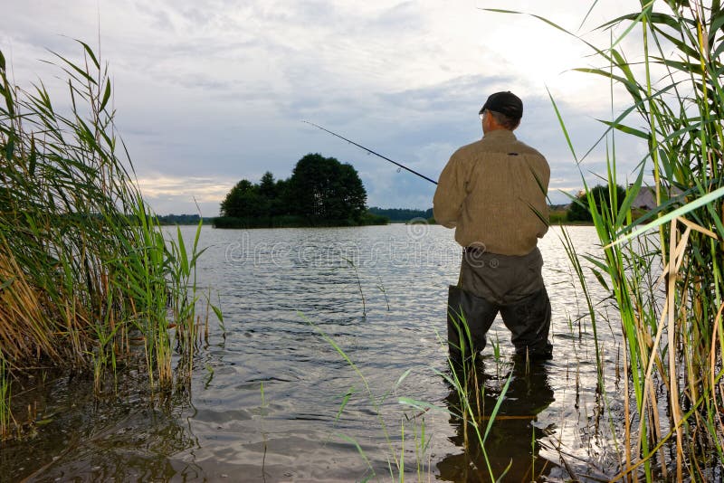 Angler stock photo. Image of spinning, activity, sunset - 121665682