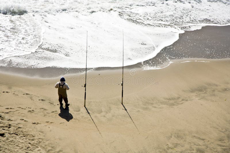 Angler at the Beach with Two Rods Editorial Stock Photo - Image of ...