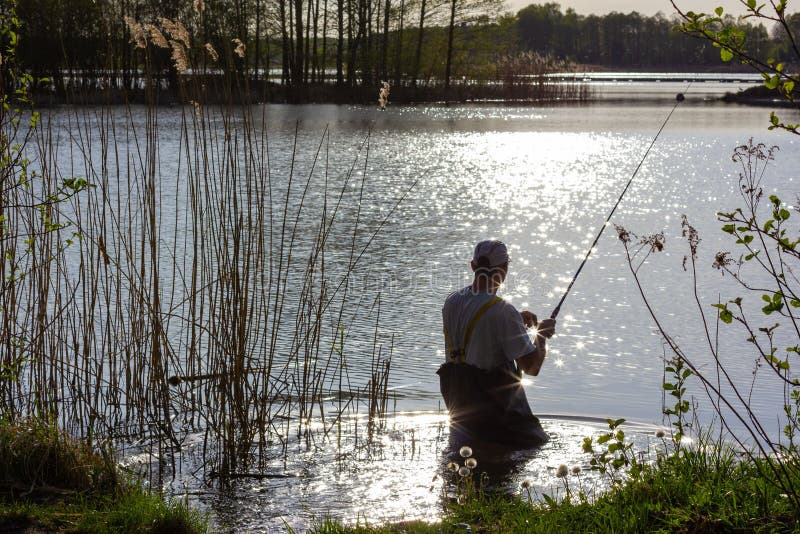 Angler stock image. Image of water, light, fisherman - 144063589