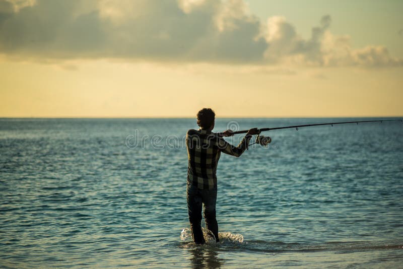 An Angler Fishing on beach editorial photo. Image of ocean - 66680271