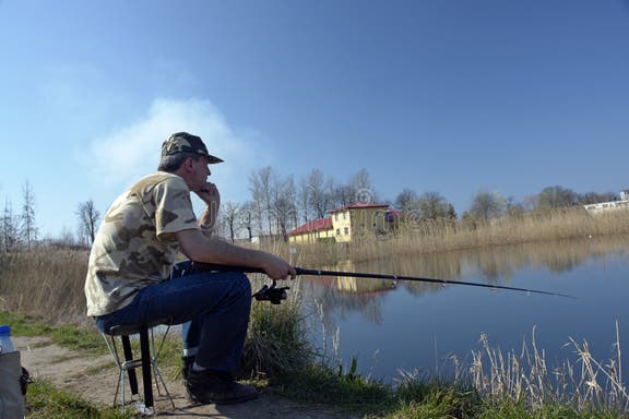 ANGLER MAN stock photo. Image of fishing, peaceful, blue - 2191376