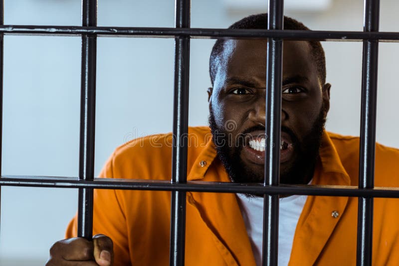 Angry African American Prisoner Holding Stock Image - Image of alone ...