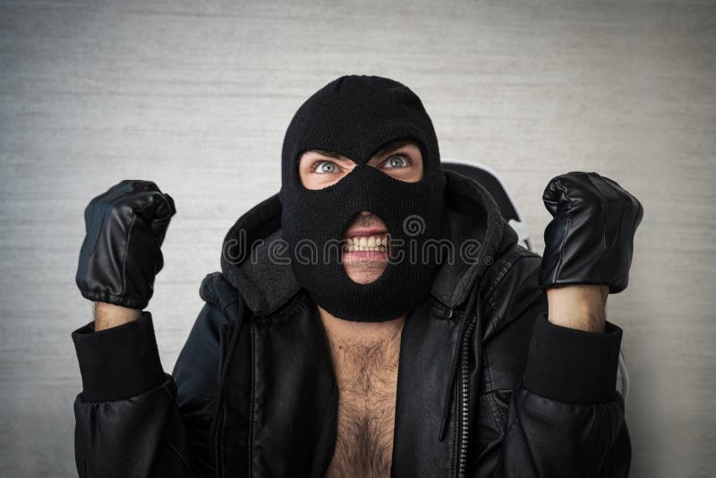 Angry Aggressive Masked Thug Screams in Anger. Stock Photo - Image of ...