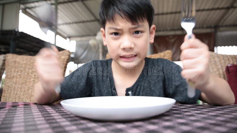 Angry Asian Child Waiting Food for Launch . Stock Video - Video of ...