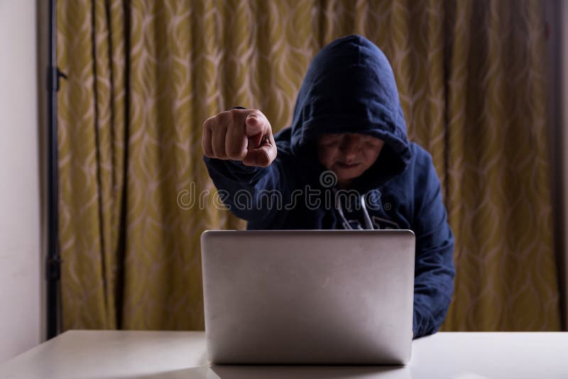 Angry Asian Hacker Pointing Finger To Camera while Hacking Network ...