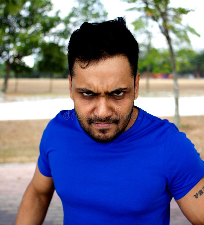 Asian Male Smirking and Thinking with Hand on Chin. Stock Photo - Image ...