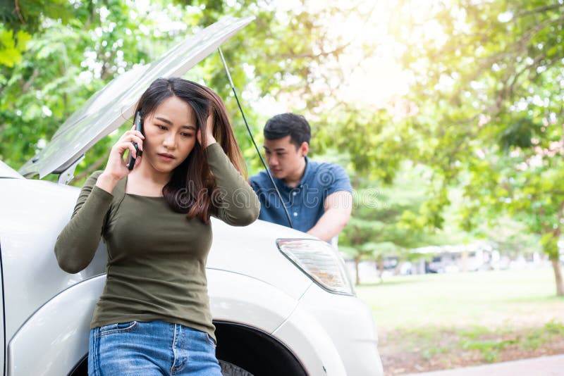 Angry Asian Man Using Smartphone for Assistance after a Car Breakdown ...