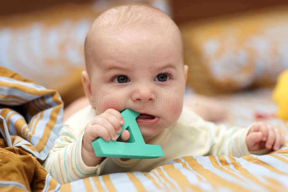 Angry baby with alphabet stock photo. Image of expressing - 23296540