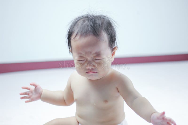 Angry baby frown in room stock photo. Image of frown - 94719166