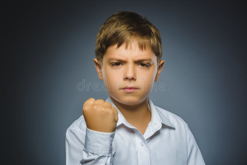 Closeup Portrait Tricky Boy Looks at the Camera Isolated on Grey Stock ...