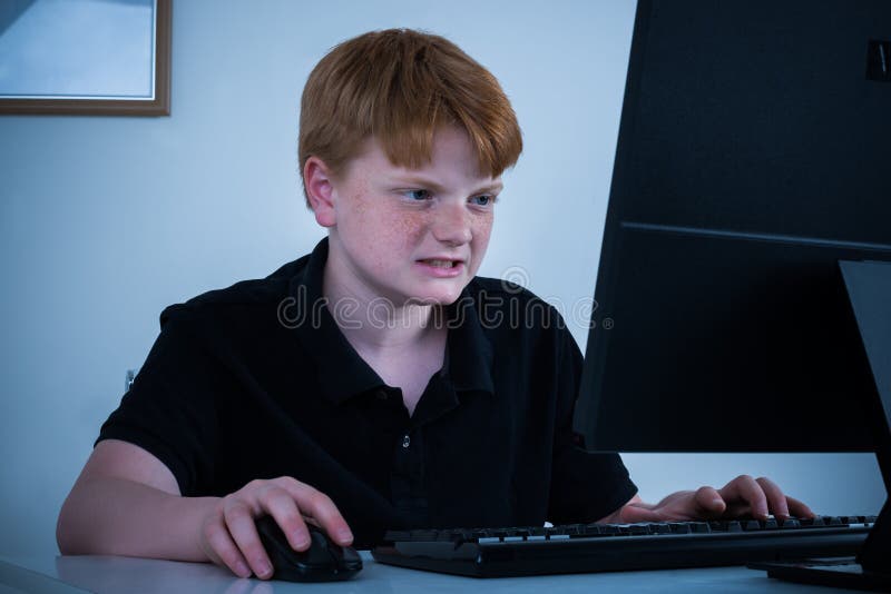 Angry Boy Working on Computer Stock Image - Image of child, people ...