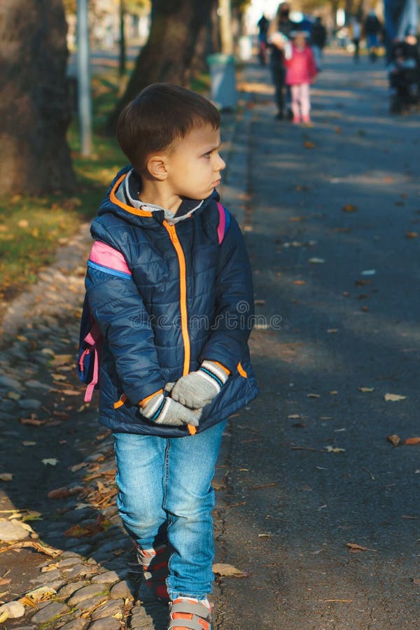 Angry boy walking in park stock photo. Image of model - 203211920