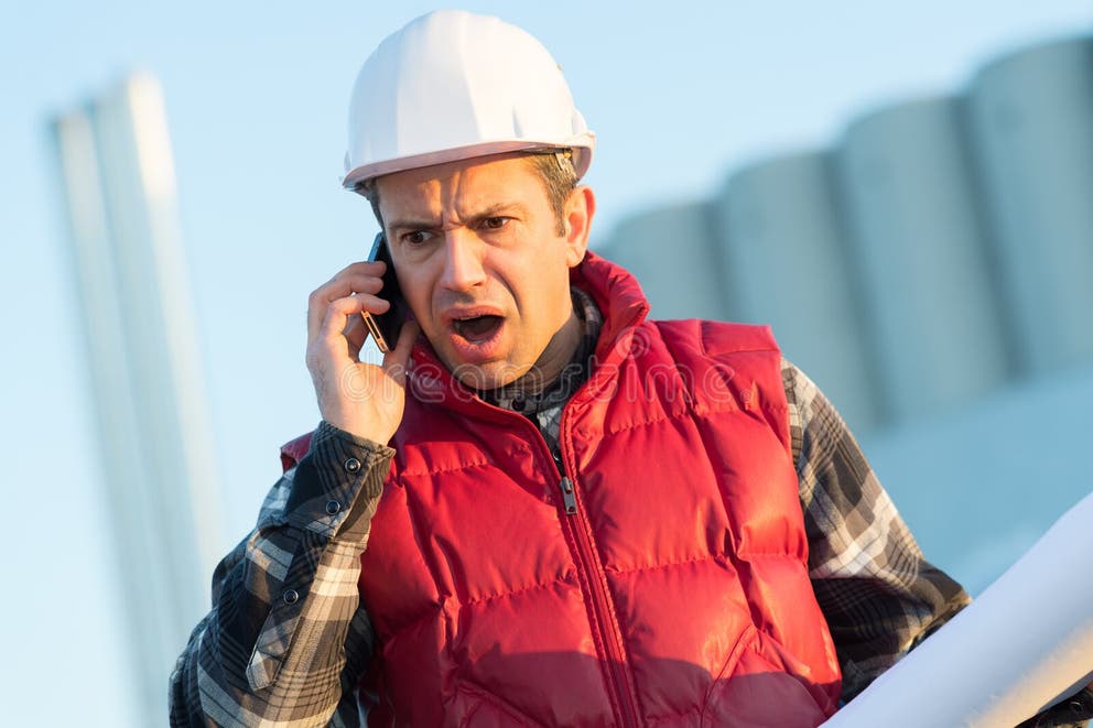 Angry builder on phone stock image. Image of serious - 277100673