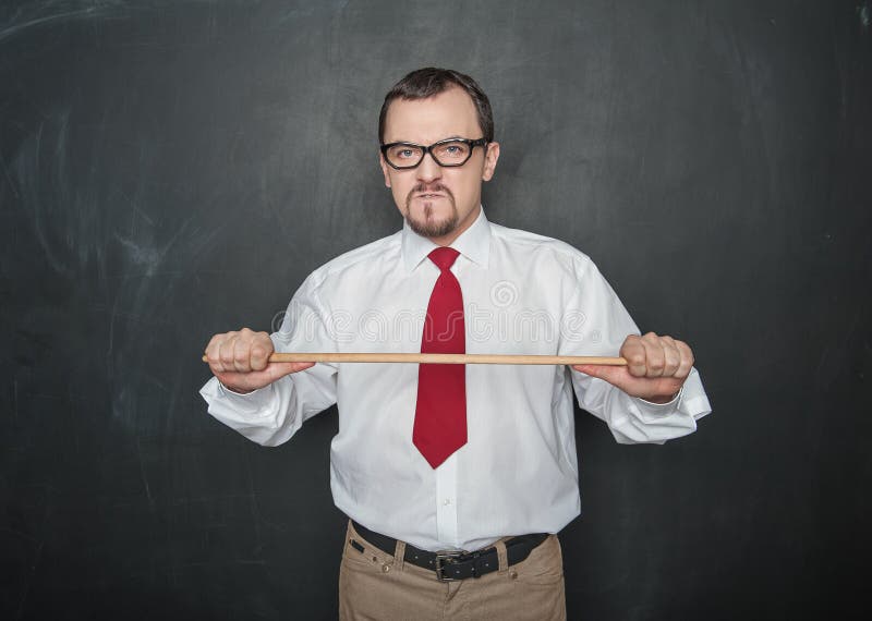 Angry Business Man or Teacher with Pointer on Blackboard Stock Image ...