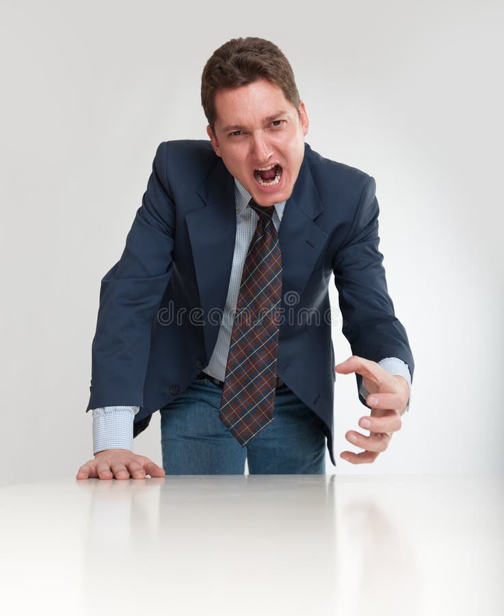 Angry Businessman Leaning on a Desk Stock Image - Image of annoyed ...