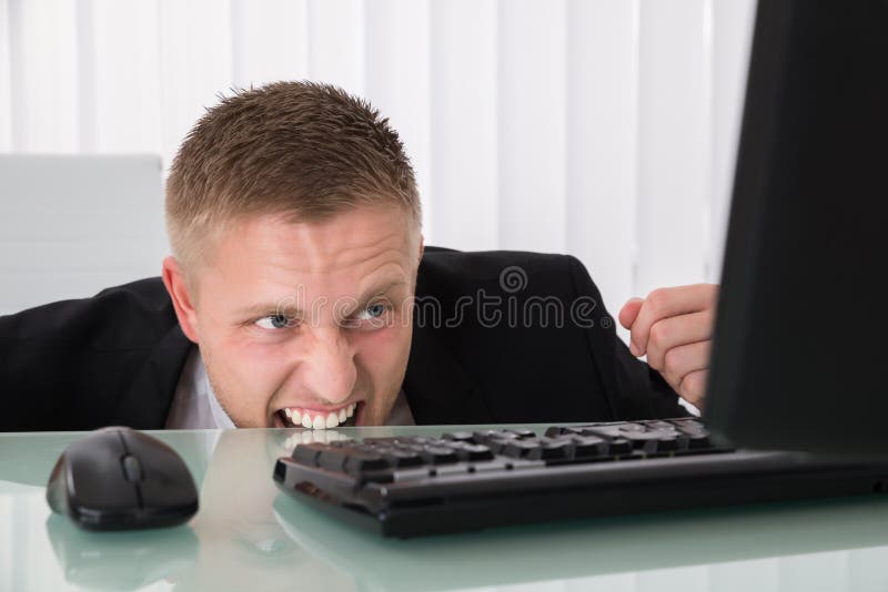 Angry Businessman Looking at Computer Stock Photo - Image of teeth ...