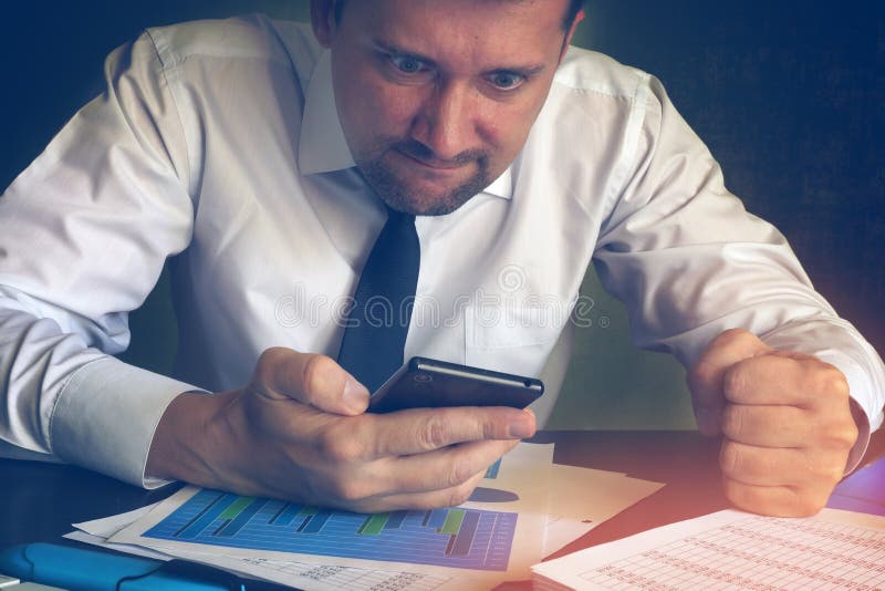 Angry Businessman Reading Message in a Smartphone. Stock Image - Image ...