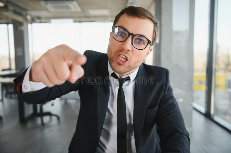 Angry Businessman Sitting at the Table and Screaming. Stock Image ...