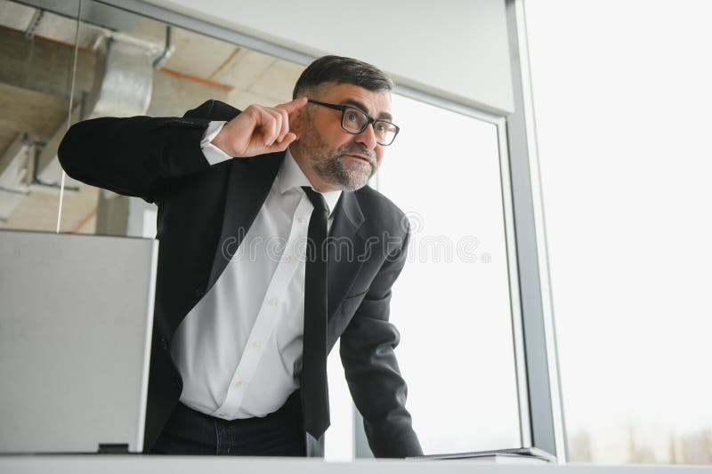 Angry Businessman Sitting at the Table and Screaming Over. Stock Image ...