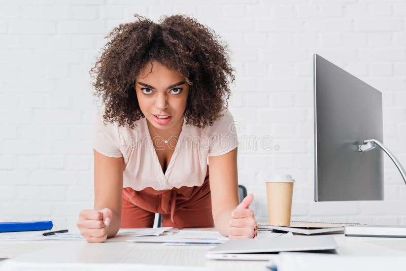 Angry Businesswoman Leaning on Table with Computer Stock Photo - Image ...