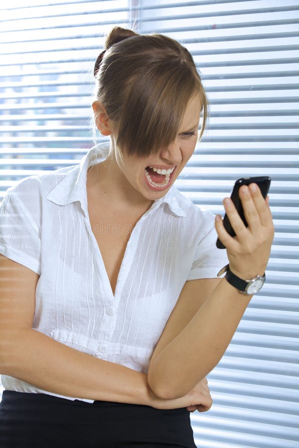 Angry Businesswoman Looking at a Mobile Phone Stock Image - Image of ...