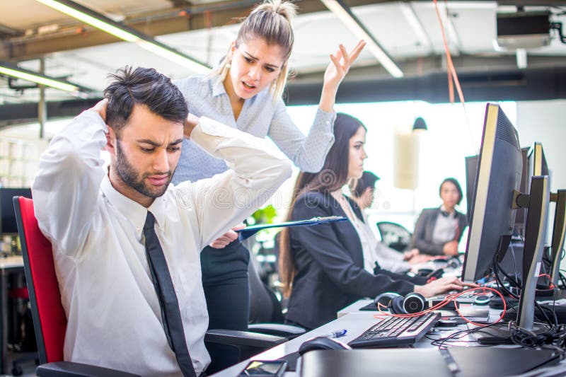 Angry Businesswoman Shouting at Her Worker with Hands Behind Head in ...
