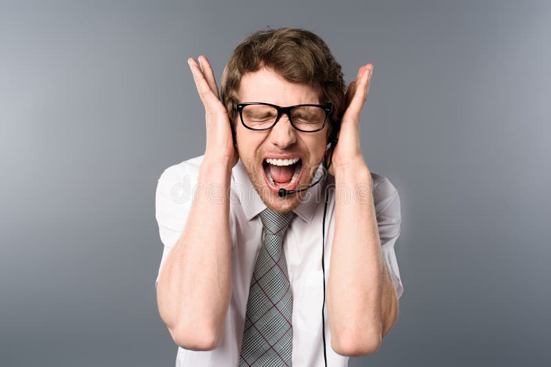 Angry Call Center Operator in Headset and Glasses Screaming with Hands ...