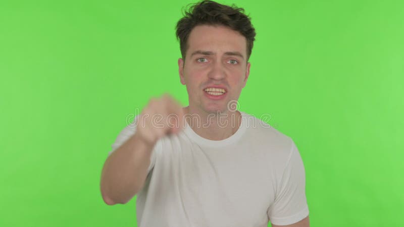 Angry Young Man Abusing on Green Background Stock Photo - Image of ...