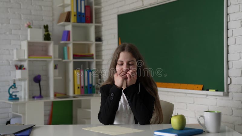 An Angry Child Stands Near the Swing, Looks into the Camera. Stock ...