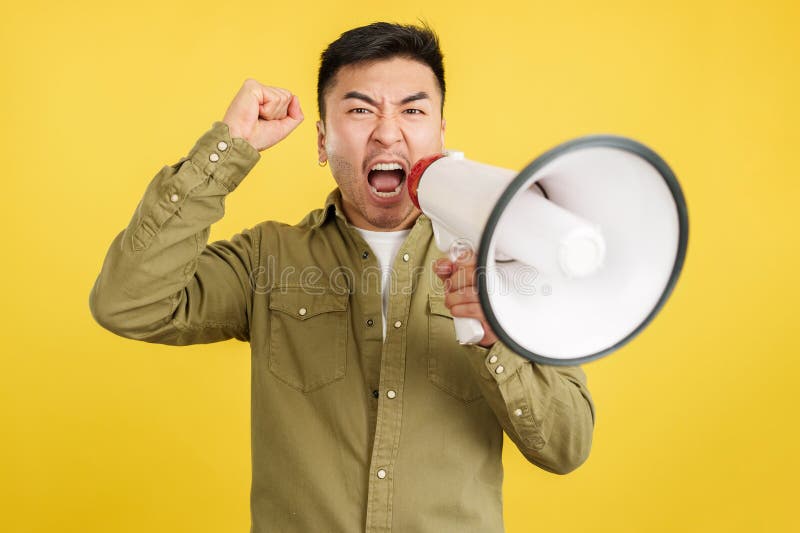 Angry Chinese Man Shouting Looking at Camera Using a Loudspeaker Stock ...