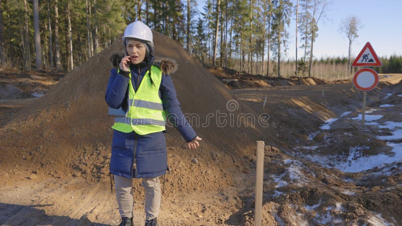 Civil Engineer in Helmet and Safety Vest Inspecting Structure and ...
